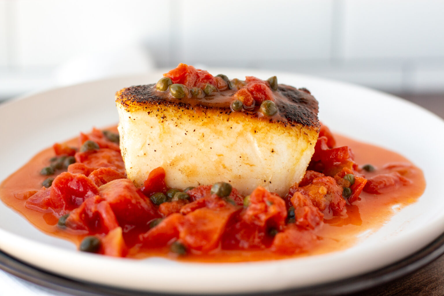Pan Seared Chilean Sea Bass with Caper Tomato Butter